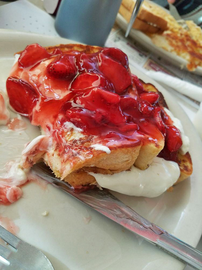 Strawberry-topped French toast that's basically dessert masquerading as breakfast. The kind of morning indulgence that makes Monday feel like Saturday.