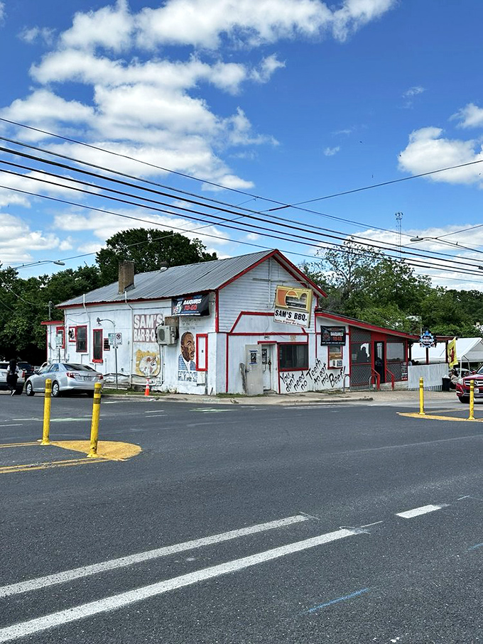 Under Texas blue skies, Sam's white exterior with red trim stands as an East Austin landmark, a barbecue beacon that's weathered decades of change.