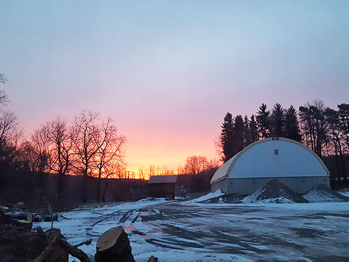 Winter sunset paints the sky in cotton candy colors above this peaceful dome structure.