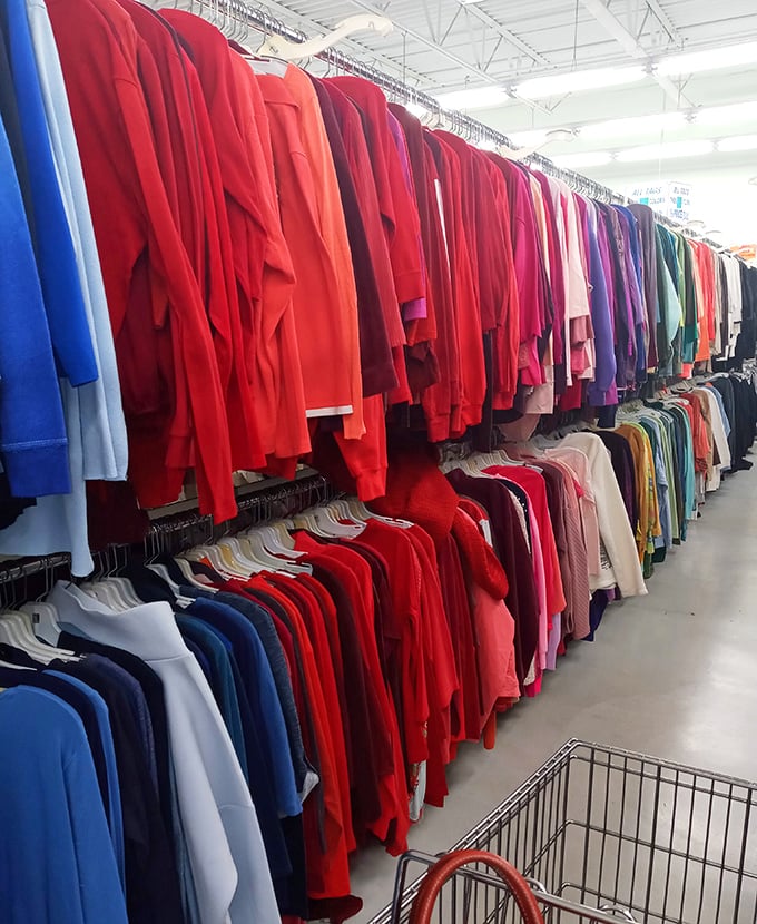 A symphony in scarlet &ndash; the color-coordinated clothing system transforms chaos into order, making this rainbow of red sweaters a visual feast.