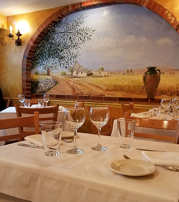 Crisp linens and countryside murals set the stage for meals that linger in memory long afterward.