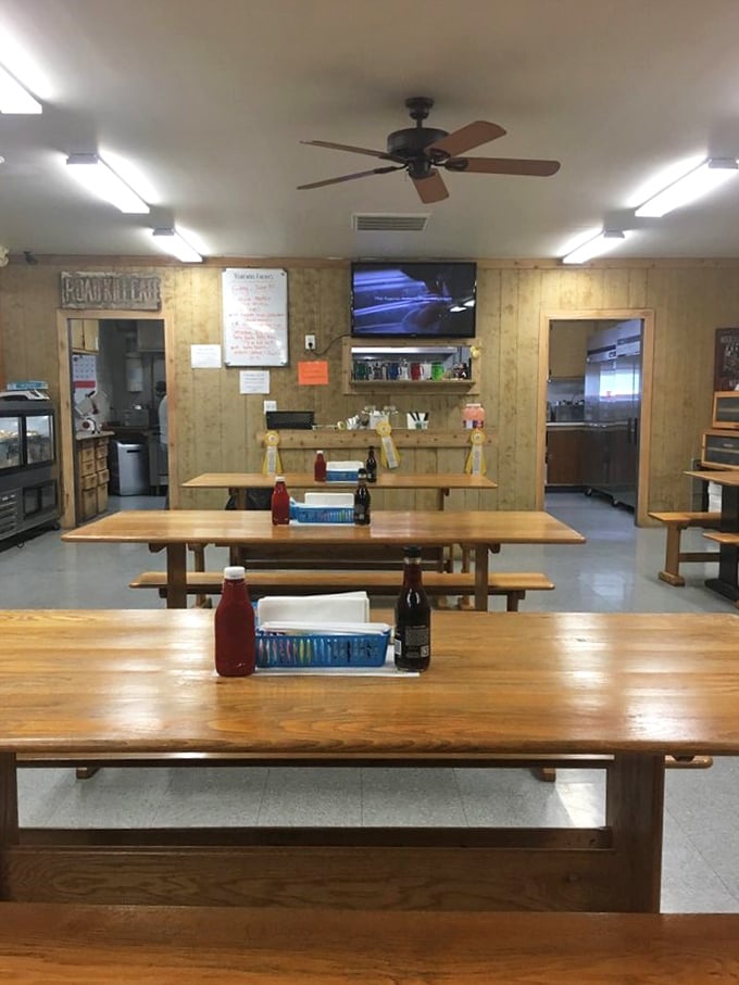 Simple wooden tables bathed in fluorescent light—where conversations flow as freely as the coffee. No designer lighting needed when the food and company shine this bright.