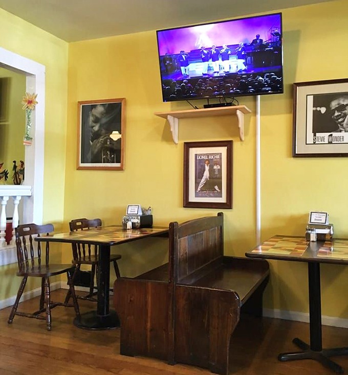 Music legends watch over diners from framed portraits, as if blessing each bite with soulful approval. Even Elvis would approve.