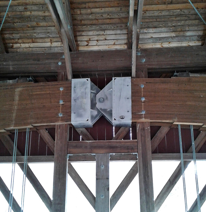 Look up inside the bridge and you'll see a wooden puzzle of interlocking beams, each piece essential to the whole.