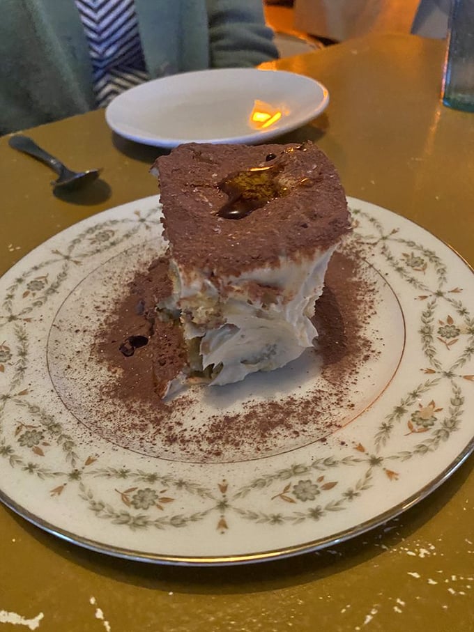 Tiramisu reimagined as architectural wonder. Layers of cocoa, mascarpone, and coffee-soaked goodness create a dessert worth saving room for.