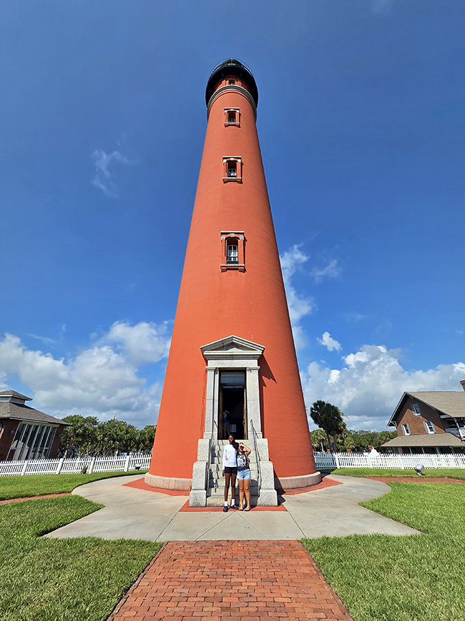 The ultimate "we were here" moment&mdash;two visitors providing scale to this towering maritime sentinel that makes humans look like maritime action figures.