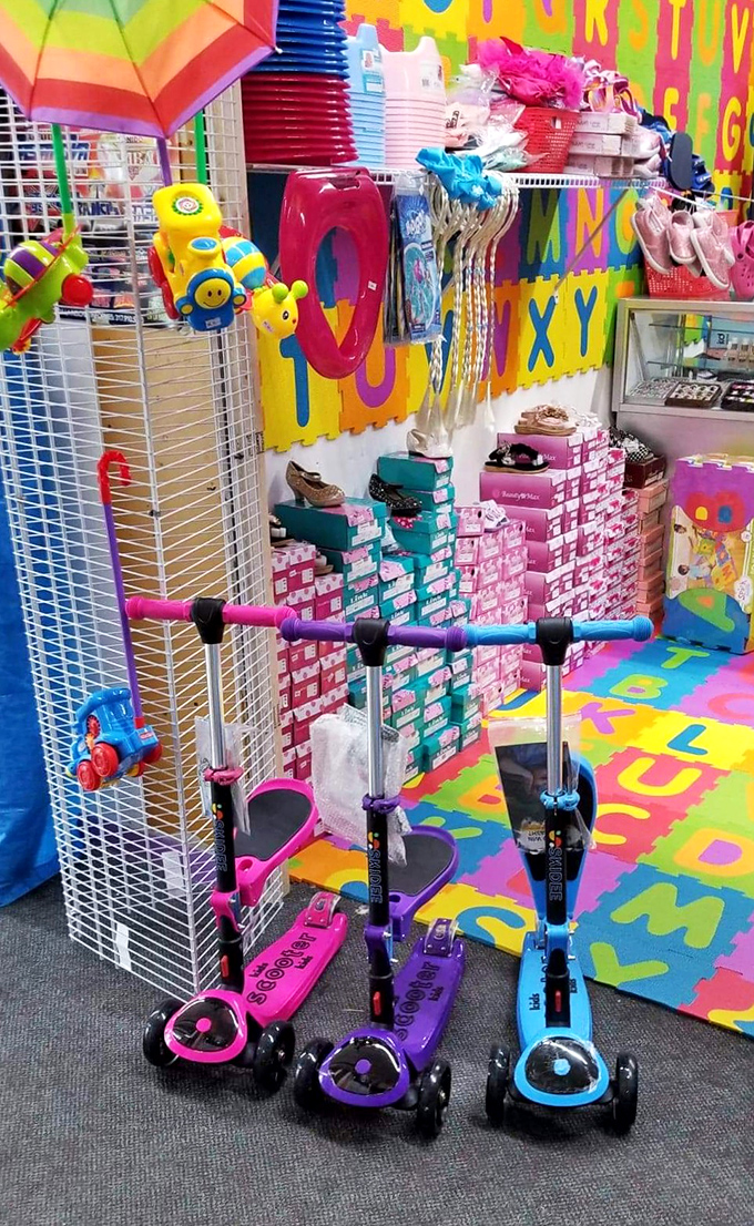 A kaleidoscope of childhood joy where alphabet floors and rainbow colors create the perfect backdrop for tiny transportation that won't break parents' banks.