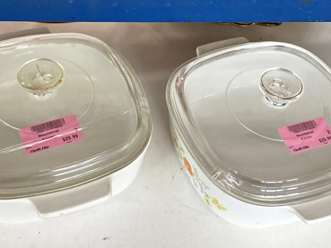 Glass cookware gleams under fluorescent lights, promising future casseroles and family dinner magic.