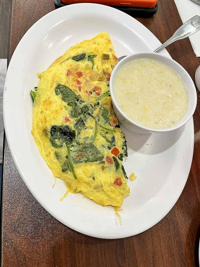 A veggie omelet that makes eating greens before noon feel like an indulgence rather than virtue. The side of grits isn't optional&mdash;it's destiny.