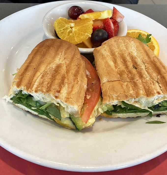 A sandwich that makes vegetables feel like they've finally made it to the big leagues. That fresh fruit side dish is virtue signaling we can all get behind.