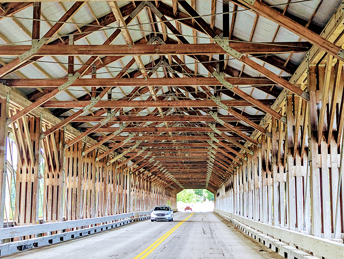 Driving through feels like passing through a portal to simpler times. The rhythm of tires on wooden planks creates its own music.