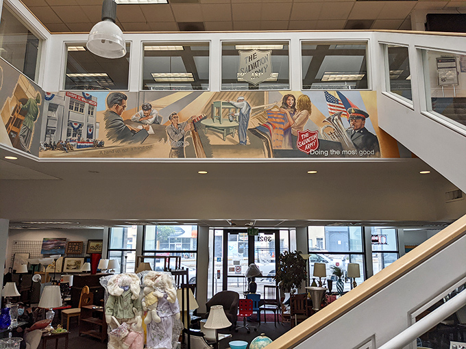 The distinctive mural above the shopping floor celebrates the organization's community service mission while adding unexpected artistic flair.