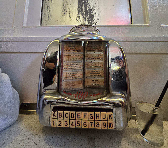 This vintage tabletop jukebox has witnessed more first dates and life decisions than most marriage counselors.