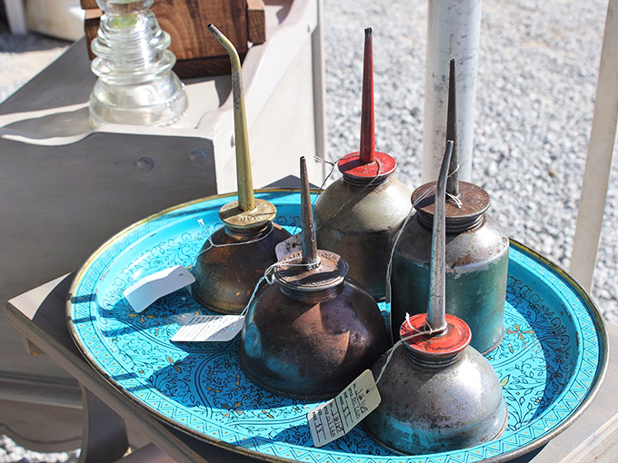Industrial poetry in metal. Vintage oil cans that once lubricated America's machines now lubricate conversations between collectors with an eye for rusty beauty.