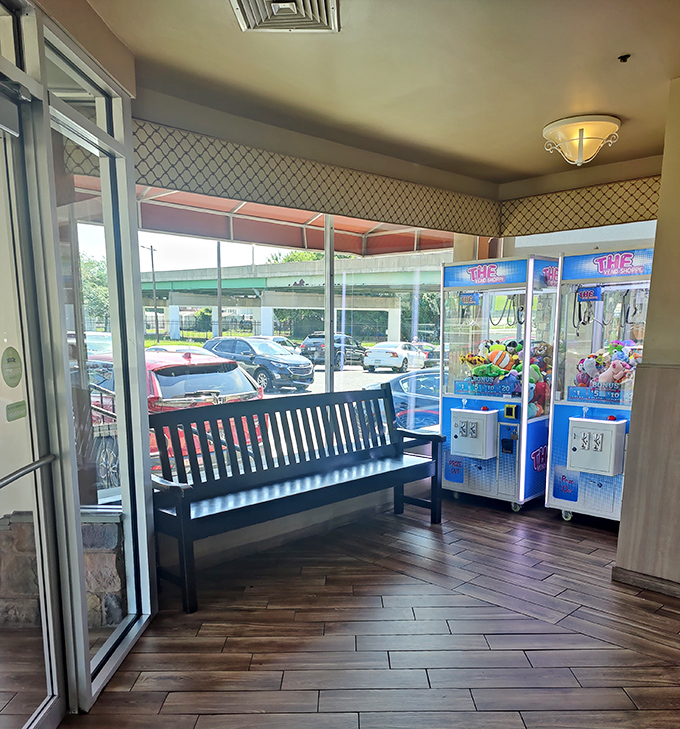 The anticipation chamber. Even the waiting area with its bench and claw machines feels like part of the Penrose experience&mdash;worth every minute.