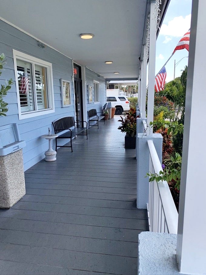 The front porch waiting area&mdash;where anticipation builds and breakfast appetites sharpen. That American flag adds a touch of patriotic pancake pride.