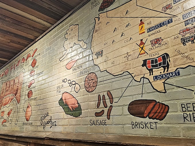 This wall isn't just decoration&mdash;it's a barbecue geography lesson and meat manifesto all in one colorful display.