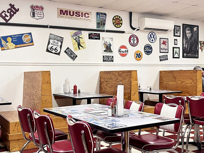 The wall of vintage signs isn't trendy decor - it's a genuine timeline of American road culture that's been collecting naturally for decades.