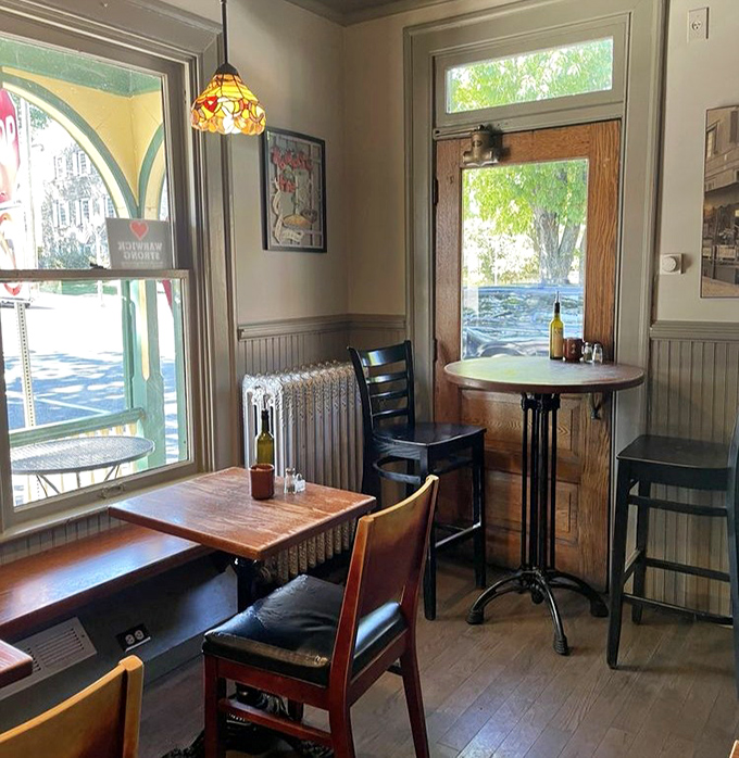 Window seats bathed in natural light offer the perfect perch for people-watching while contemplating a second helping of tomato pie.