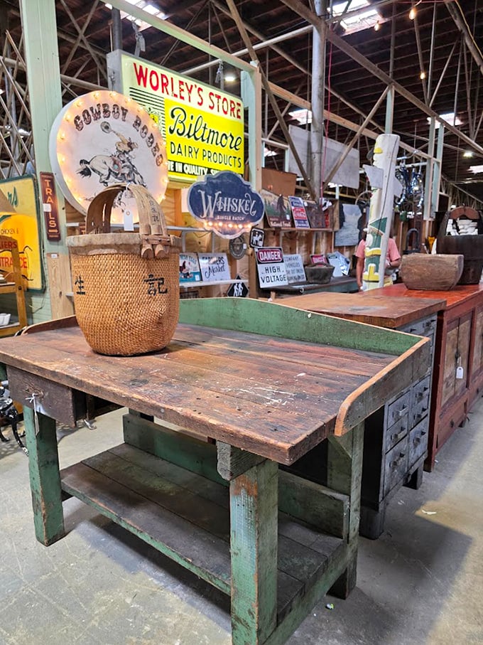 That weathered workbench has seen more projects than your weekend warrior neighbor ever will. Biltmore Dairy sign included!