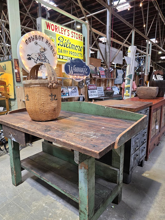 That weathered workbench has seen more projects than your weekend warrior neighbor ever will. Biltmore Dairy sign included!