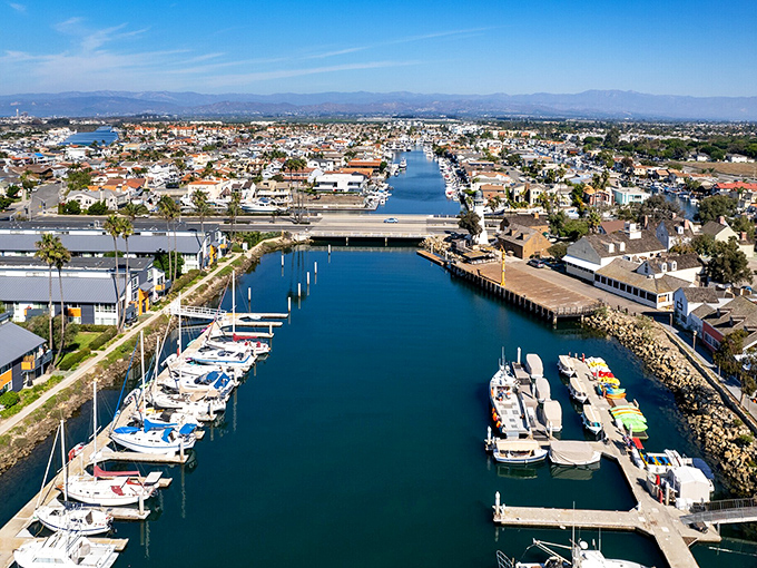 The busy marina filled with boats shows this town's genuine connection to the sea and fishing traditions.