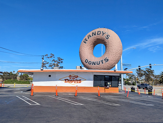 Randy's iconic architecture proves that sometimes the best advertising is a 32-foot-tall donut sculpture.