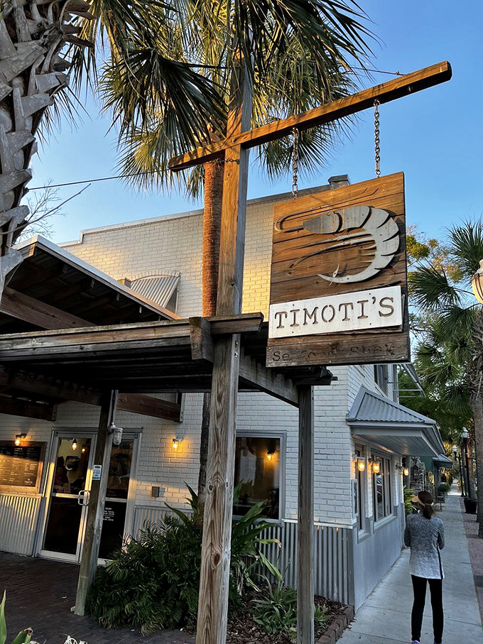 Timoti's wooden sign hanging from that rustic post is like something from a seafood lover's dream.