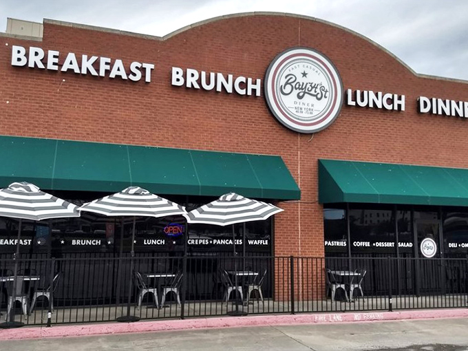 Striped umbrellas and outdoor seating at Bay34th Street Diner create the perfect spot for people-watching.