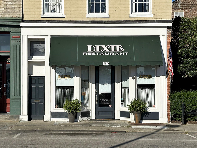 Green awning and classic storefront design invite you into a world where biscuits and gravy reign supreme.
