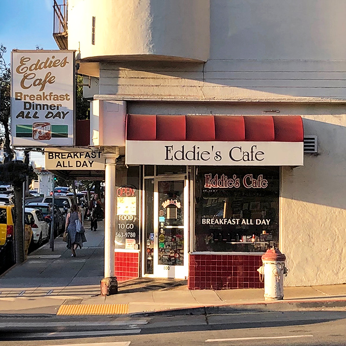 That classic red awning signals something special &ndash; where locals gather for pancakes and genuine conversation.