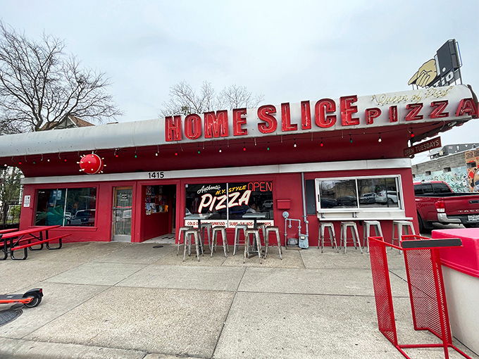 Red and white stripes signal serious pizza ahead on Austin's most famous street.