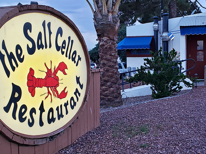 That cheerful red lobster practically winks at you, hinting at the subterranean seafood magic below.