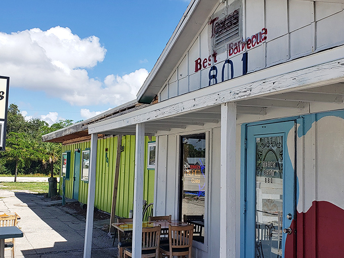 Simple white building, blue door, and "801" address&mdash;remember these details for your barbecue treasure map.