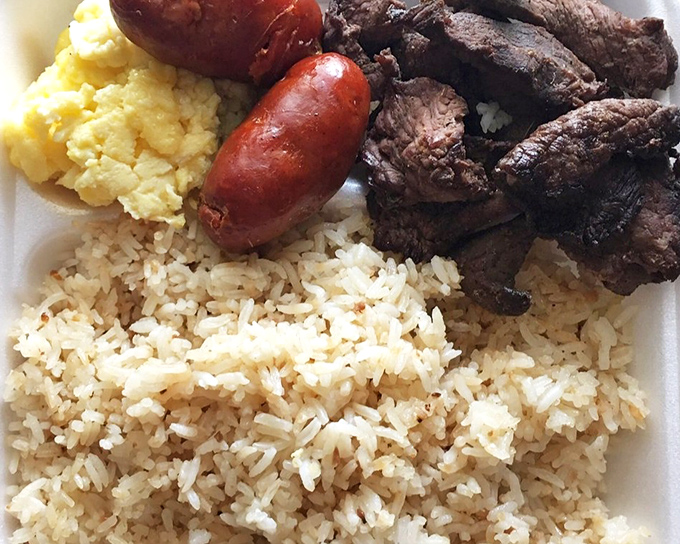 The Filipino breakfast trinity: garlic rice, perfectly cooked meat, and eggs &ndash; proving that breakfast champions exist across all cultures. 