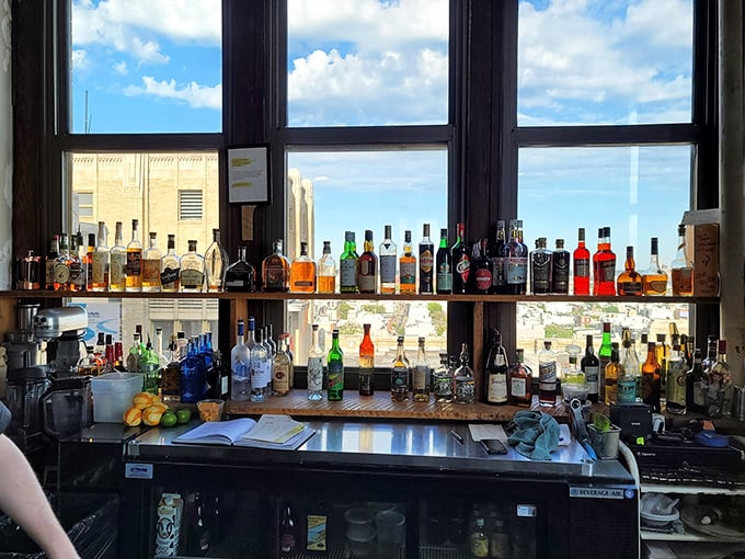 The liquid library of Irwin's. This thoughtfully curated collection of spirits frames the Philadelphia skyline, promising perfect pairings for your Sicilian feast.