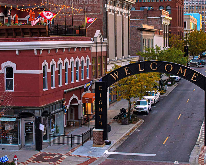 The Welcome Arch glows against an autumn sunset, while Kansas City Chiefs flags flutter proudly above&mdash;hometown pride comes in many forms here.