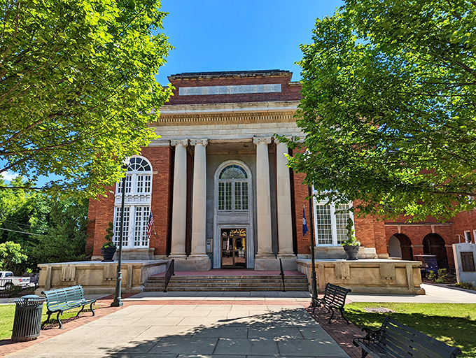 Abbeville's courthouse columns stand like sentinels guarding democracy, a reminder that small towns take their civic architecture as seriously as their barbecue.