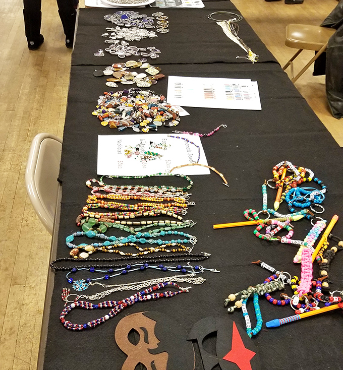 Bohemian treasure trove. Handcrafted beads and colorful jewelry spread across the table like an artist's palette waiting to adorn new owners.