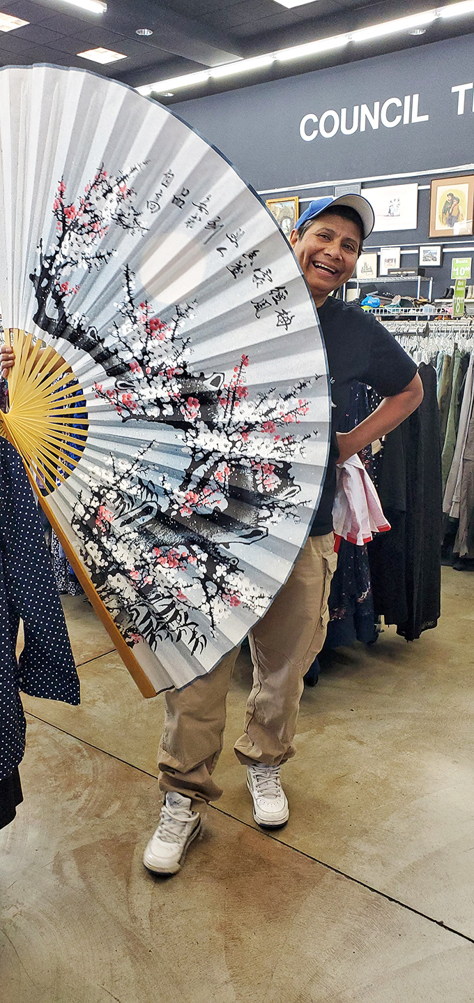 Unexpected treasures like this ornate decorative fan transform shopping into a cultural exploration—part store, part museum, all adventure.