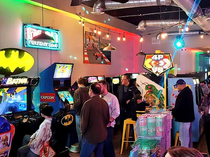 The universal language of "just one more game" spoken fluently across generations beneath the glow of arcade lights.