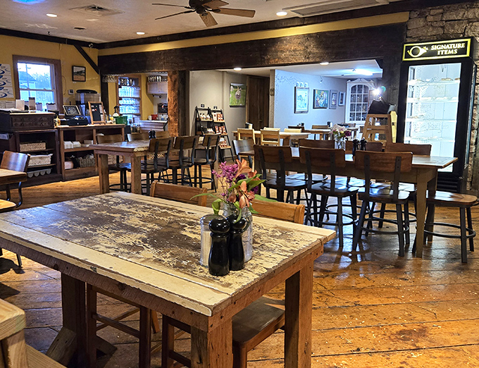 A spacious dining area where rustic meets refined, with tables arranged for both intimate conversations and lively gatherings.