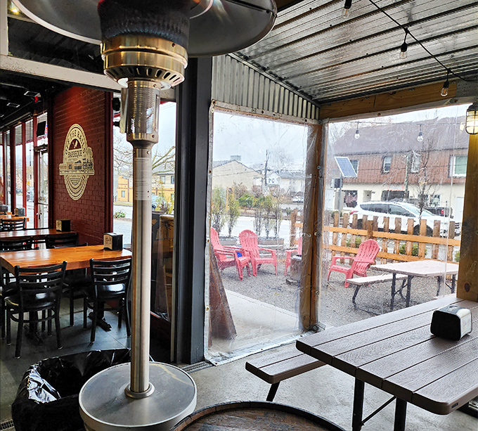 Windows flood the space with light while heat lamps keep the patio cozy year-round comfort.