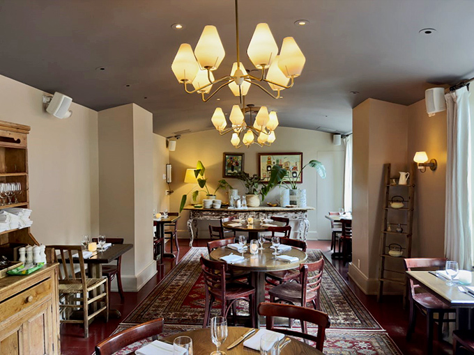 Another dining room reveals a different personality &ndash; elegant chandeliers, oriental rugs, and tables set for memorable conversations.