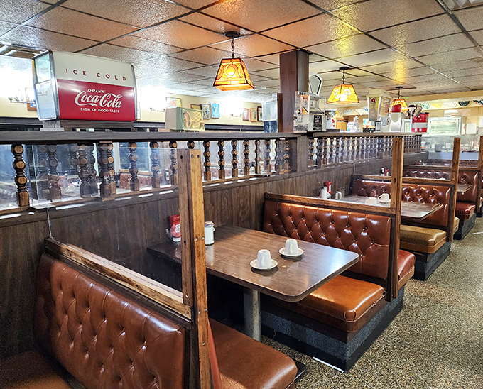 Tufted booths separated by wooden dividers create little kingdoms where breakfast reigns supreme and coffee is the currency of conversation.