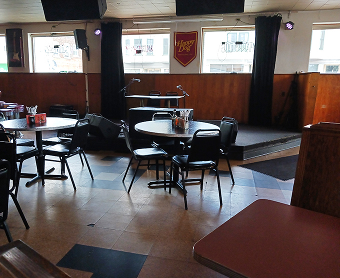 Simple tables waiting for hungry patrons &ndash; each one a blank canvas for the hot dog artistry about to unfold.