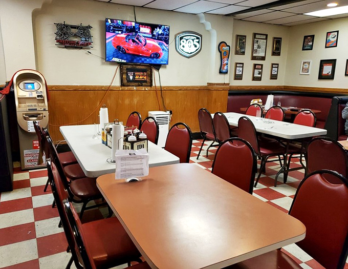 Red chairs, checkered floors, and TVs tuned to the game&mdash;the classic American BBQ joint formula executed to perfection.