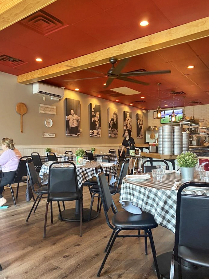 Black and white photos on the wall tell stories while the red ceiling watches over diners creating memories of their own.