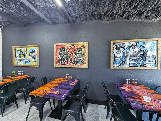 Sports-themed art watches over diners like barbecue guardian angels. These tables have witnessed countless "first bite" faces&mdash;the universal expression of BBQ bliss.