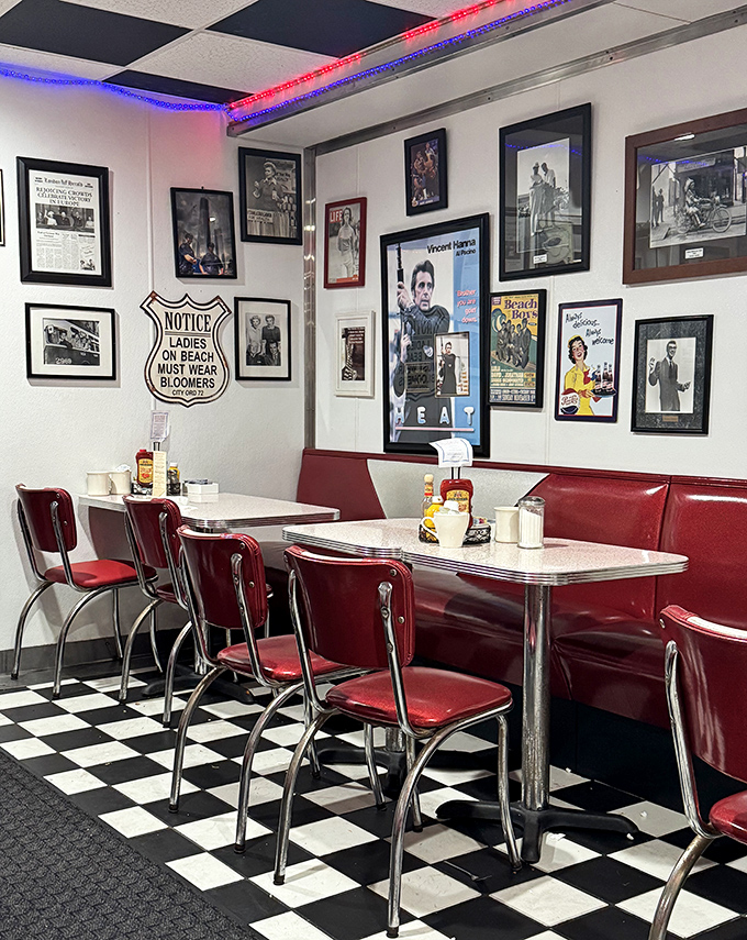 Vintage memorabilia covers the walls like a scrapbook of American pop culture, creating the perfect backdrop for red booths that have cradled countless conversations.